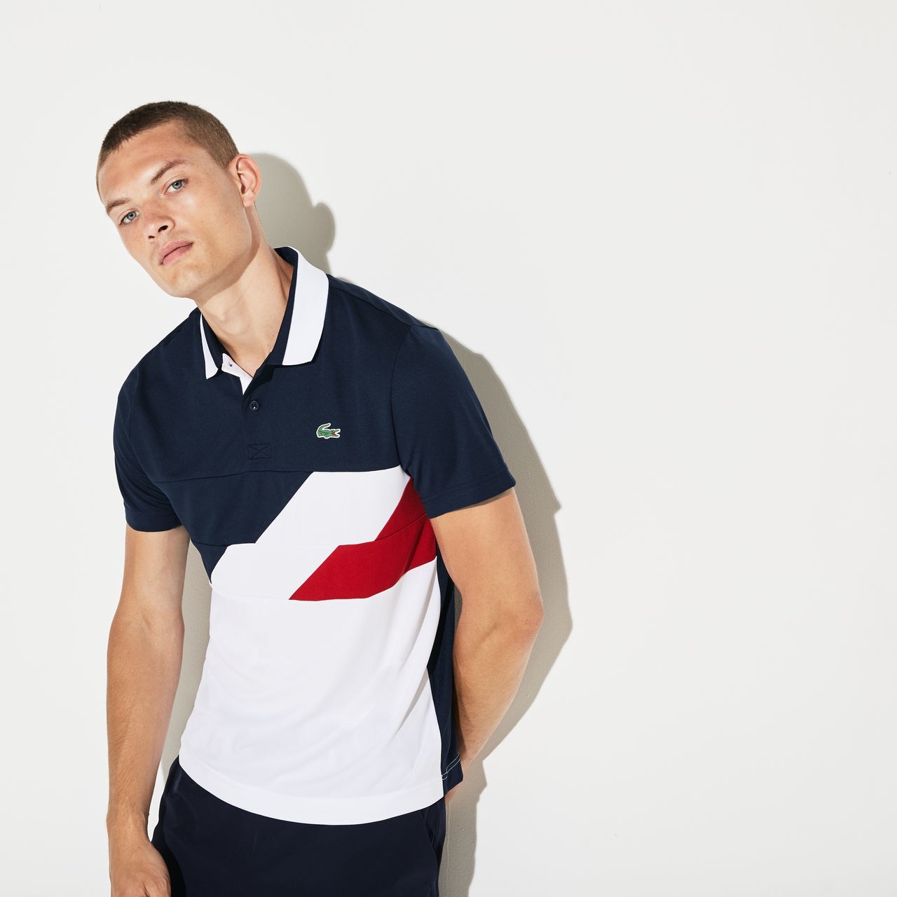 Lacoste POLO TENNIS SPORT EN PIQUÉ TECHNIQUE À BANDES COLO NAVY BLUE ...
